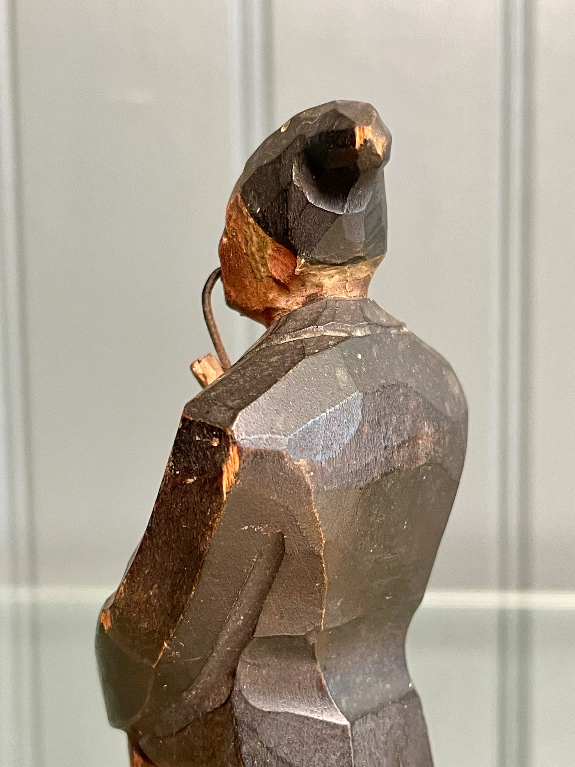 Carved wooden man with pipe - B Southgate